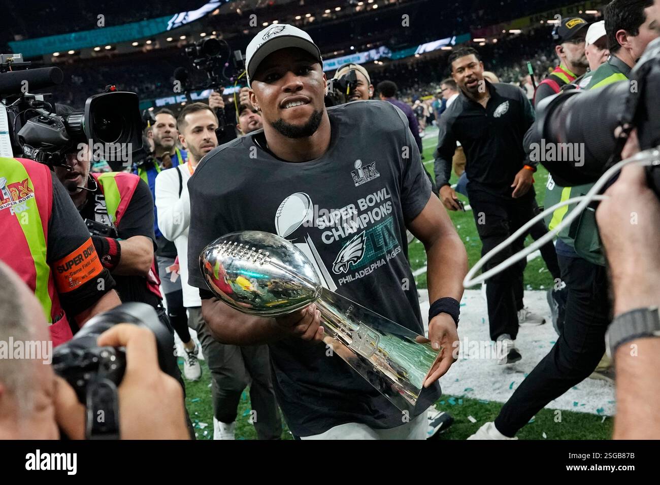 Philadelphia Eagles running back Saquon Barkley carries the Vince ...