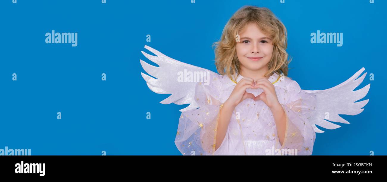 Valentines day. Kid with angel wings. Studio portrait of angel child on ...