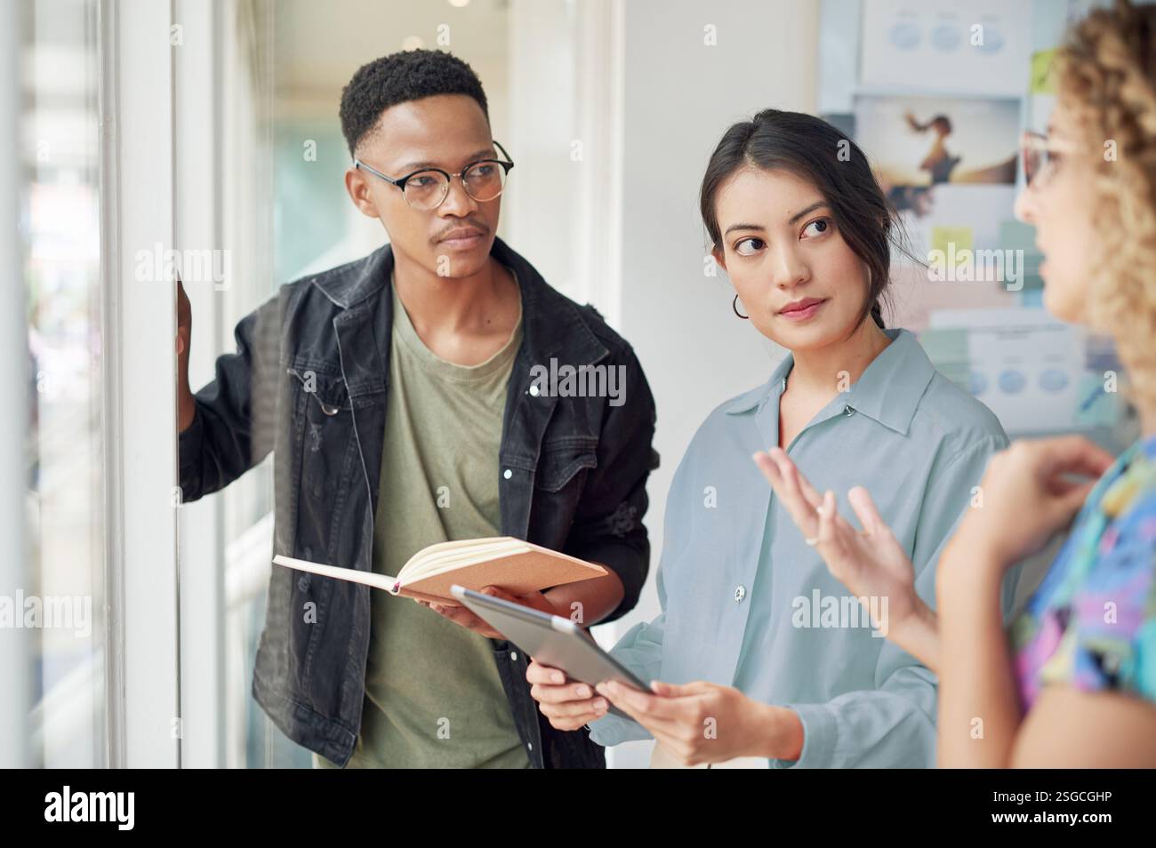 Creative, discussion and group of business people at moodboard with ...