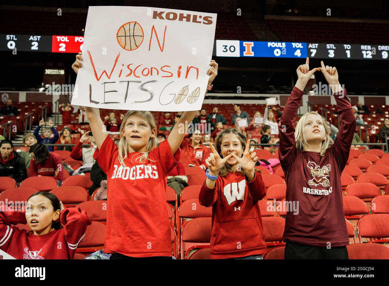 Madison, Wisconsin, USA. 9th Feb, 2025. Three young fans cheer on the ...
