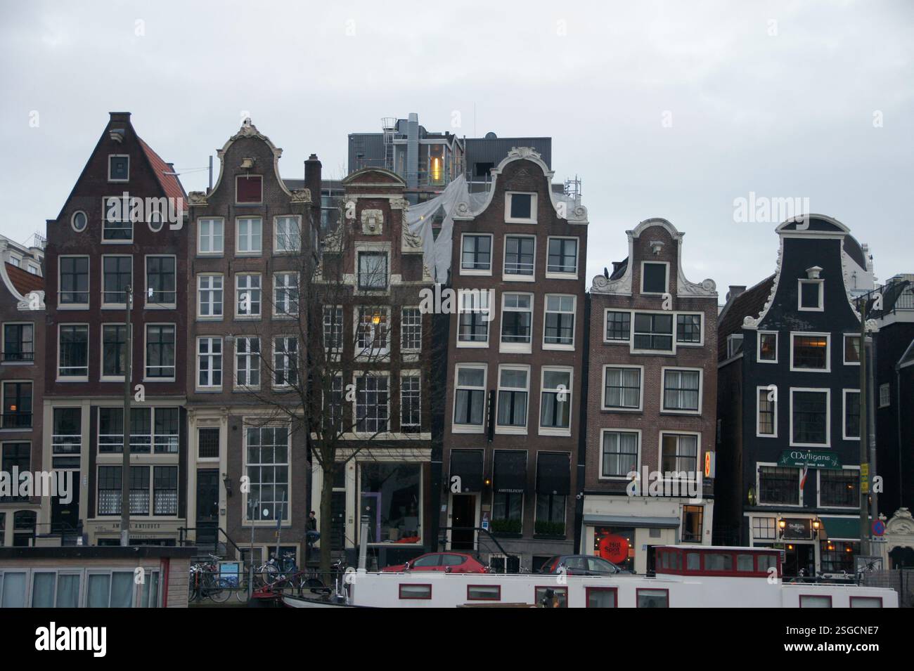 Amsterdam's vibrant canal houses flank a scenic waterway. A canal tour ...