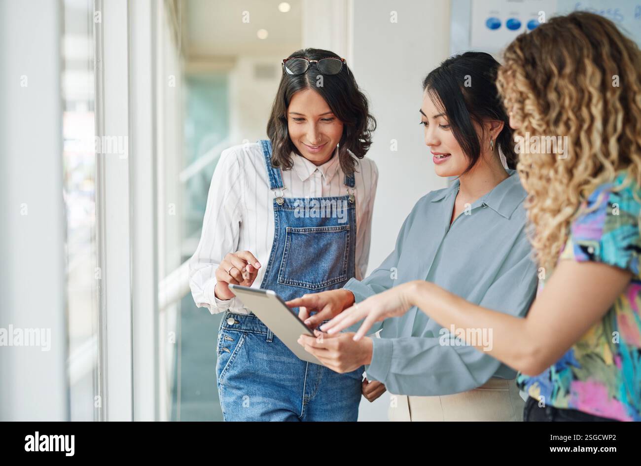 Creative, discussion and group of women with tablet, collaboration and ...