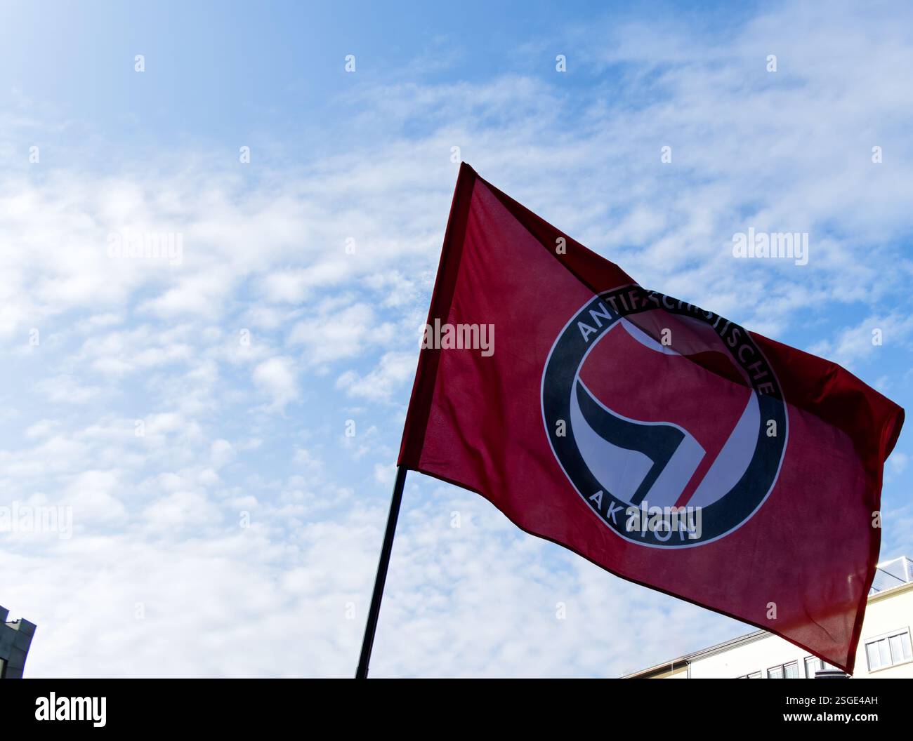 Hanover, Germany, February 8, 2025: Red flag with black and white anti ...