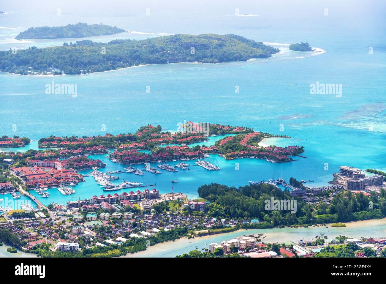 Aerial view of a luxurious resort and marina nestled in the turquoise ...
