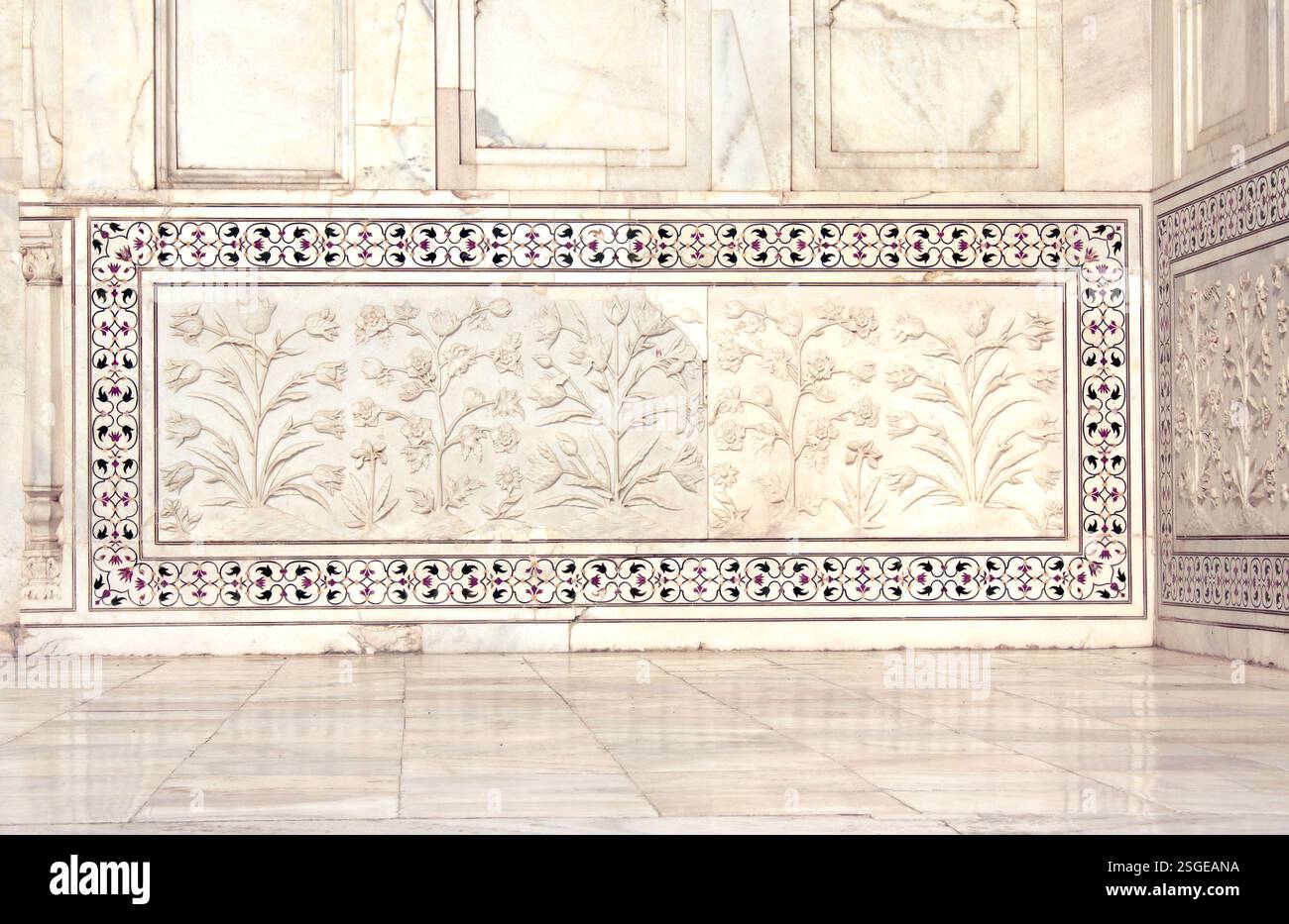 Ancient carved floral decor on marble wall in Taj Mahal, India. Details ...