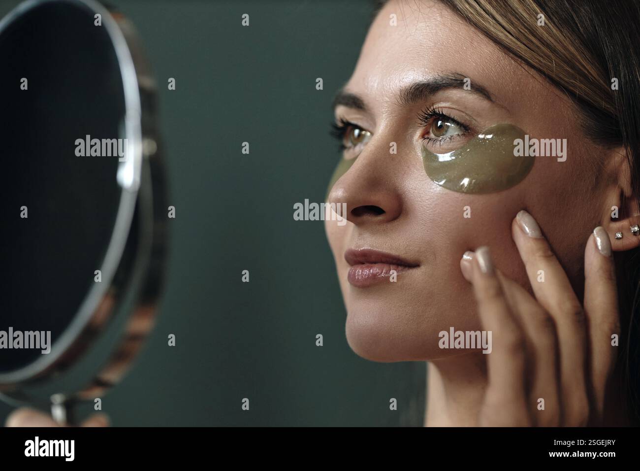 Applying Under Eye Patches For Skin Care Routine Stock Photo - Alamy