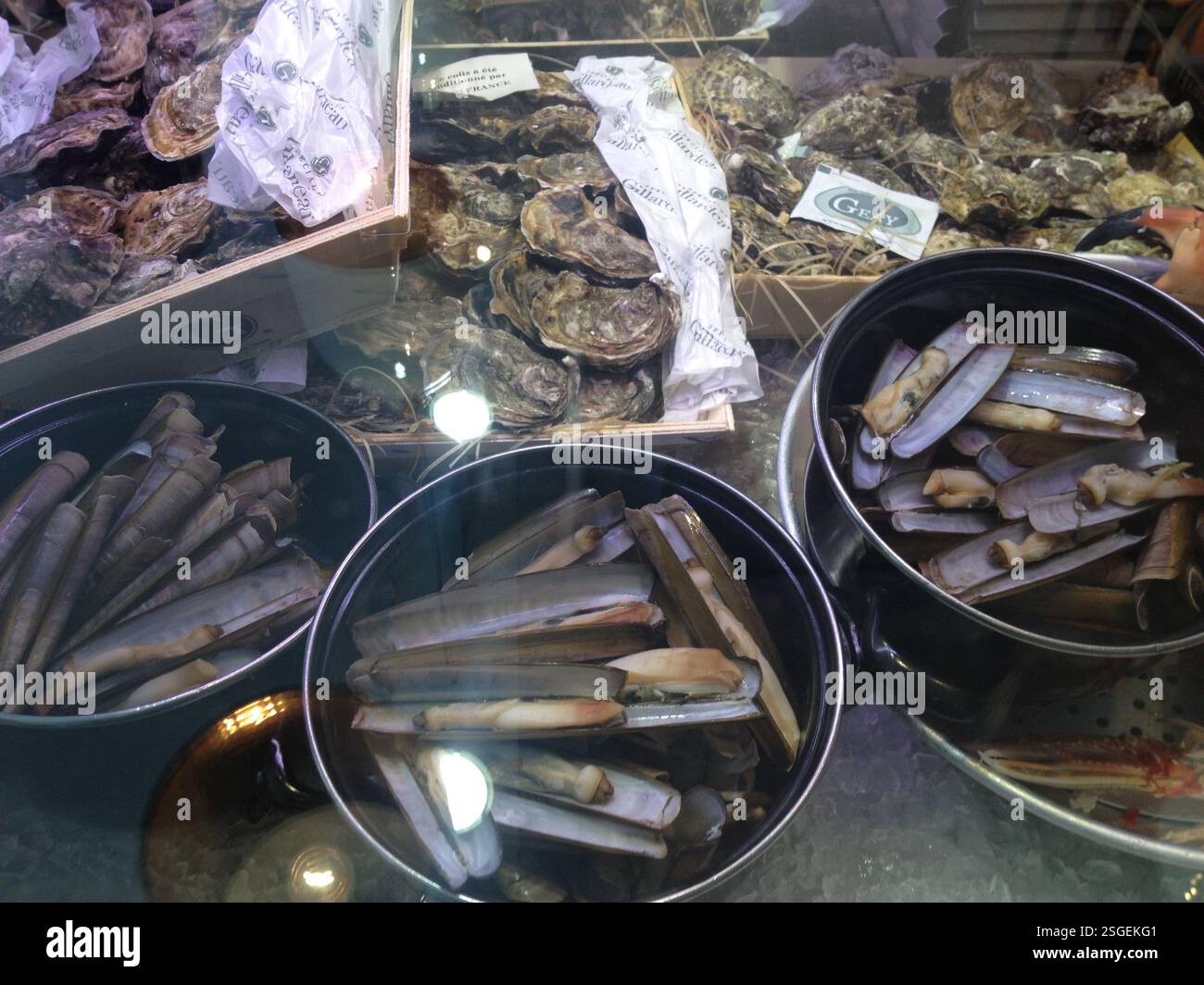 A display table at a fish market in Amsterdam overflows with fresh ...