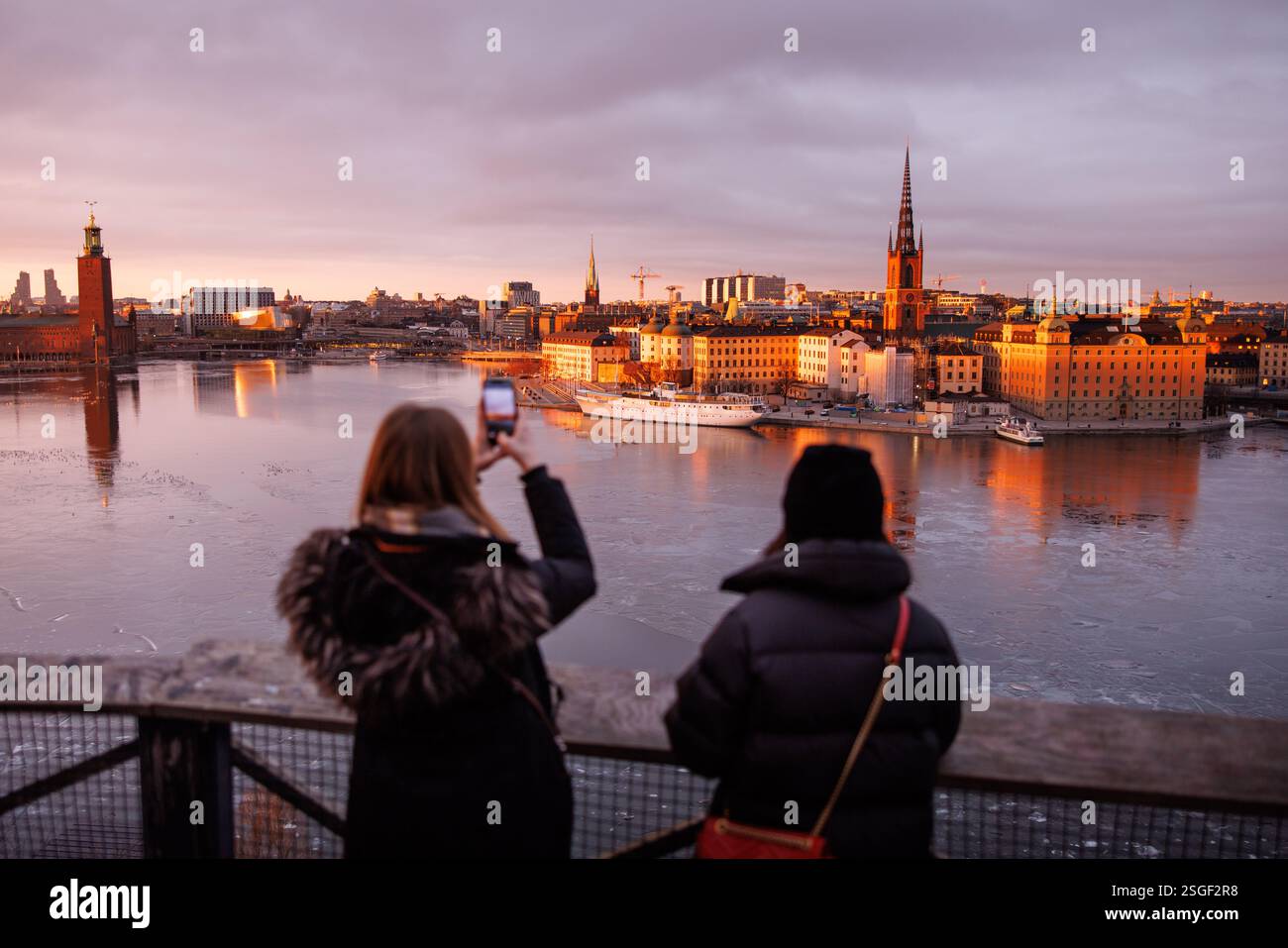 Stockholm, Sweden. 24th Feb, 2024. A woman takes a photo with her ...