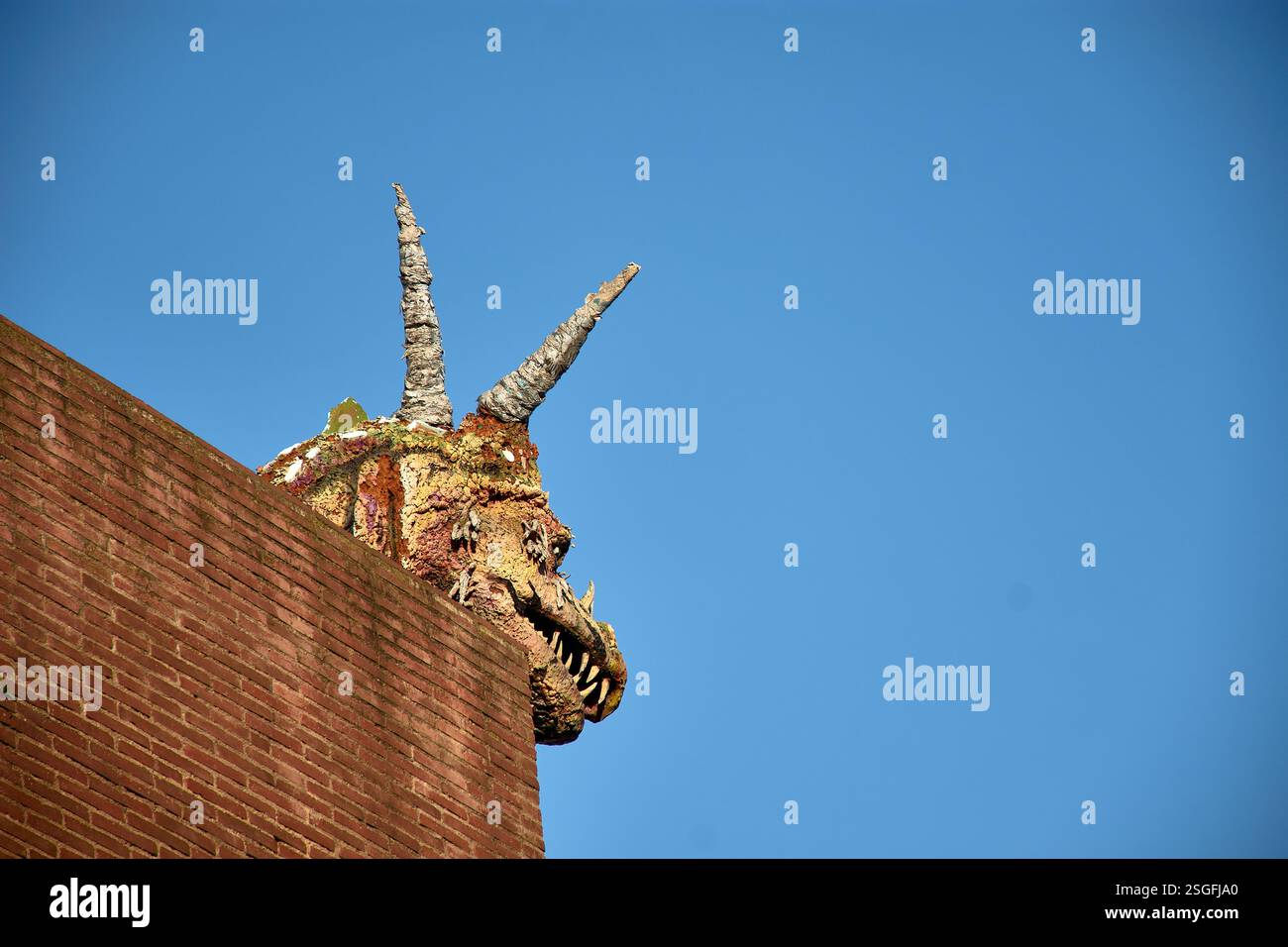 a majestic dragon head sculpture located in Cimadevilla, the oldest and ...