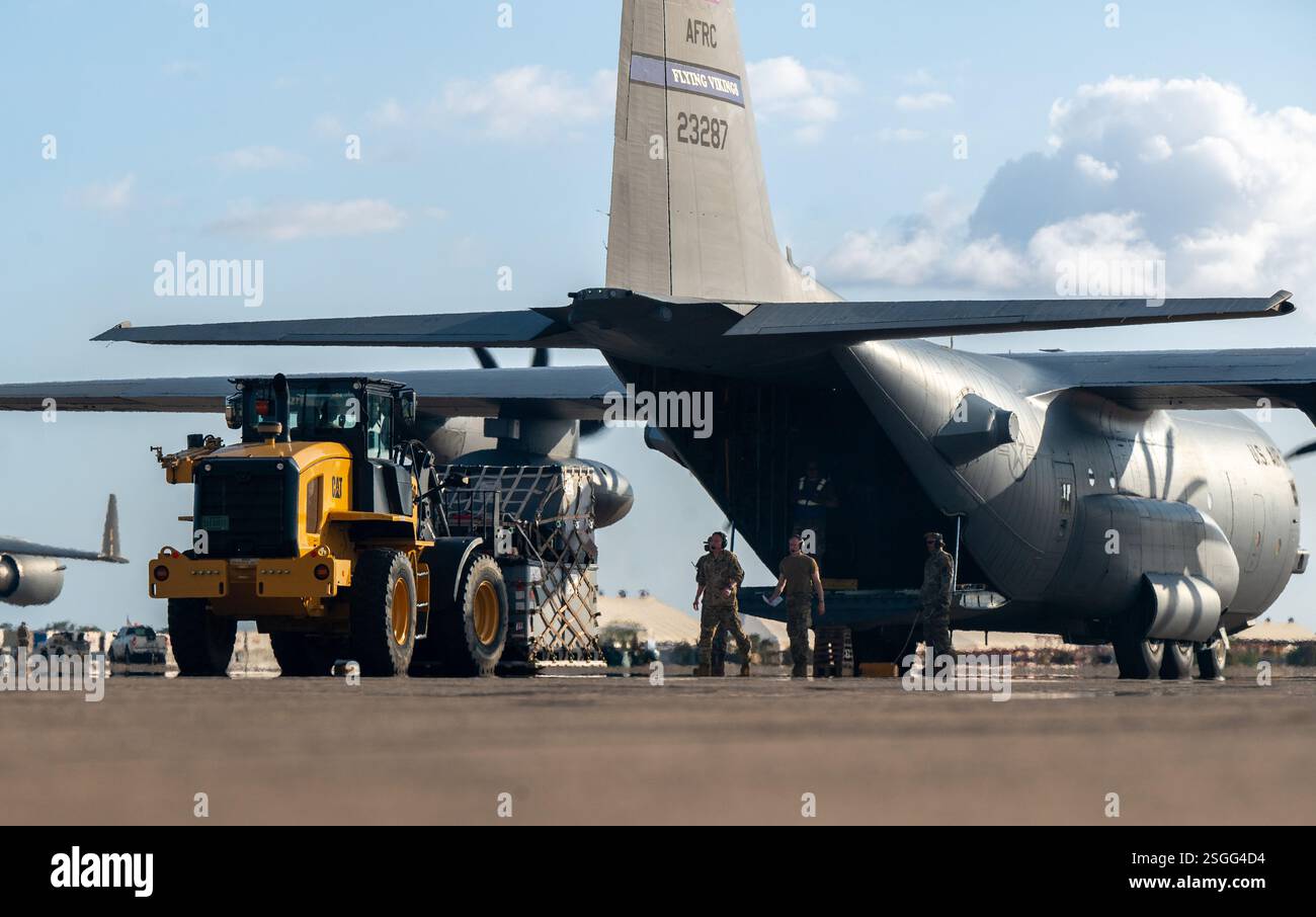Citizen Airmen prepare to load cargo onto a C-130 Hercules III assigned ...