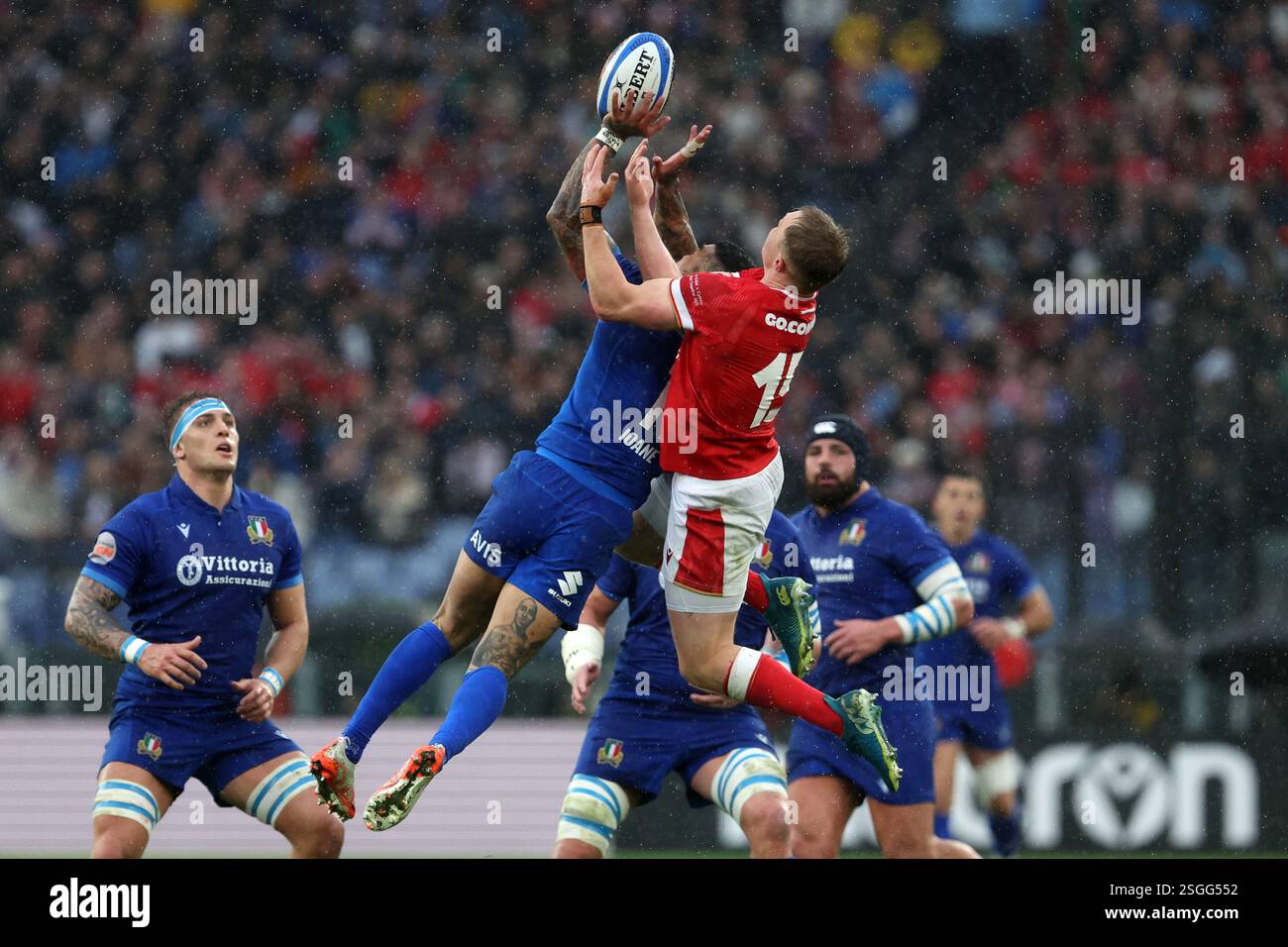 Monty Ioane of Italy, and Josh Hathaway of Wales are seen in action ...