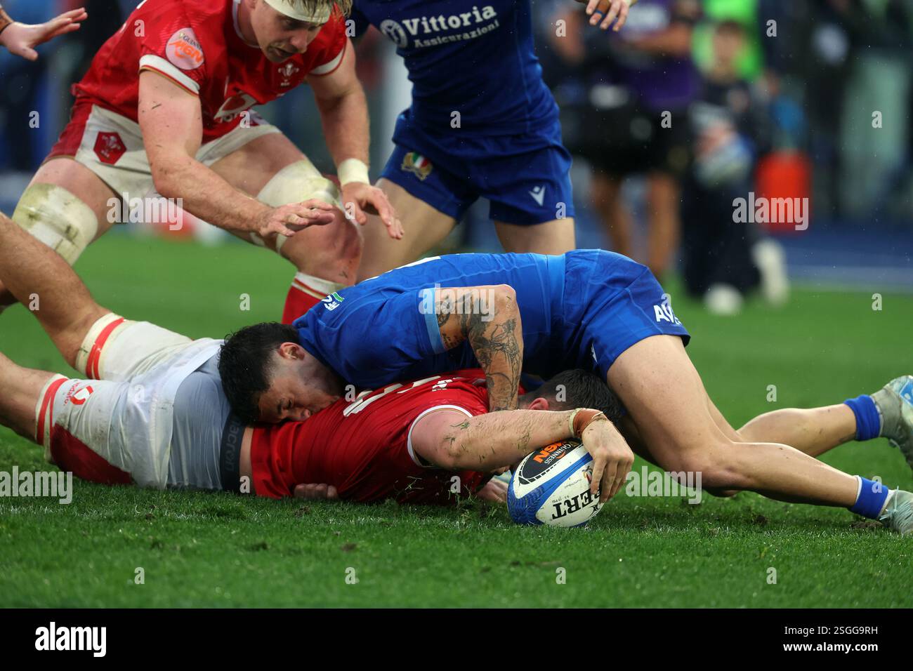 Dafydd Jenkins of Wales, and Jacopo Trula of Italy are seen in action ...