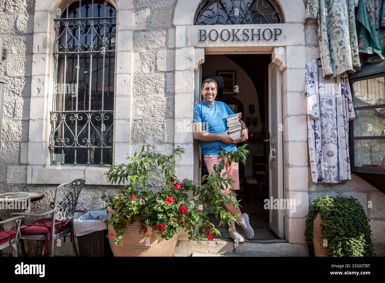 Mahmoud Muna, one of the owners of East Jerusalem's historical Educational Bookshop seen outside ...