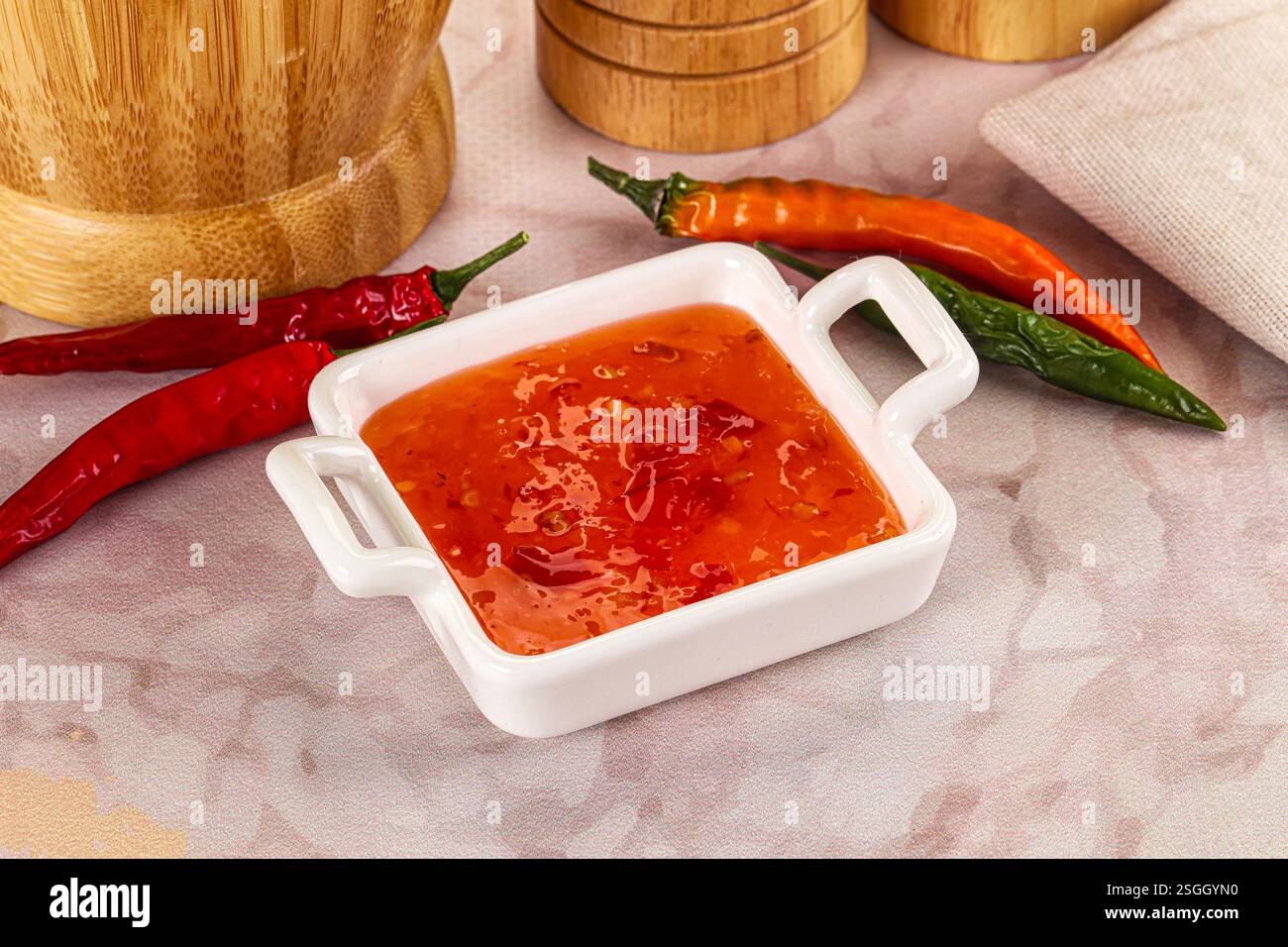 Sweet and sour chili sauce with pineapple pieces Stock Photo - Alamy