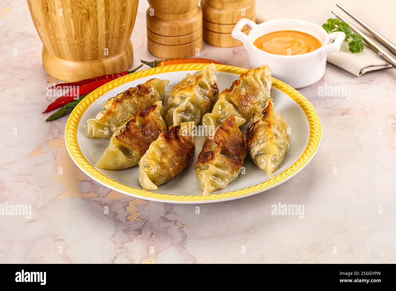 Japanese fried Gyoza stuffed dumplings with sauce Stock Photo - Alamy