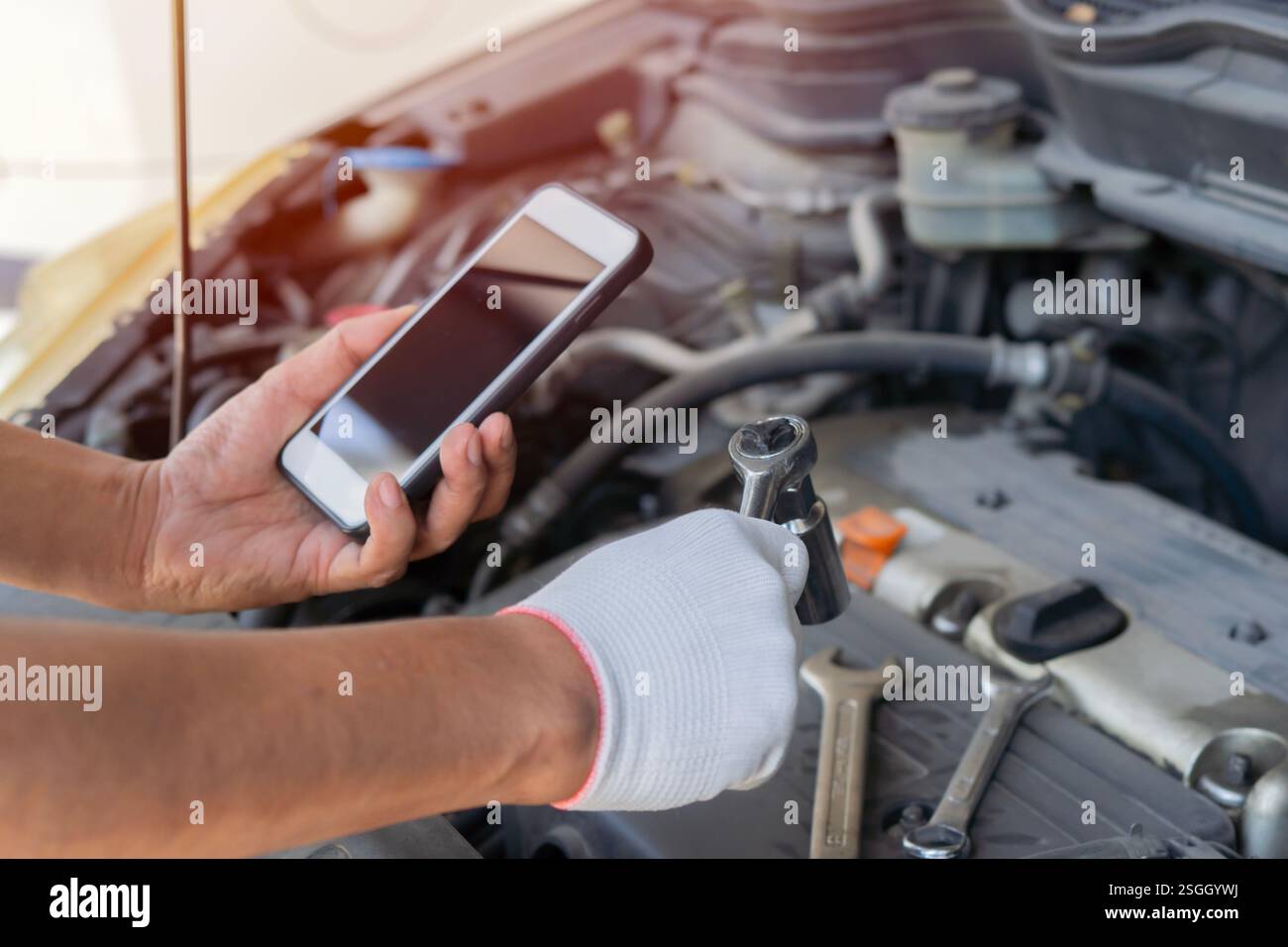 Mechanical fixing car at home. Repairing Service advice by mobile phone ...