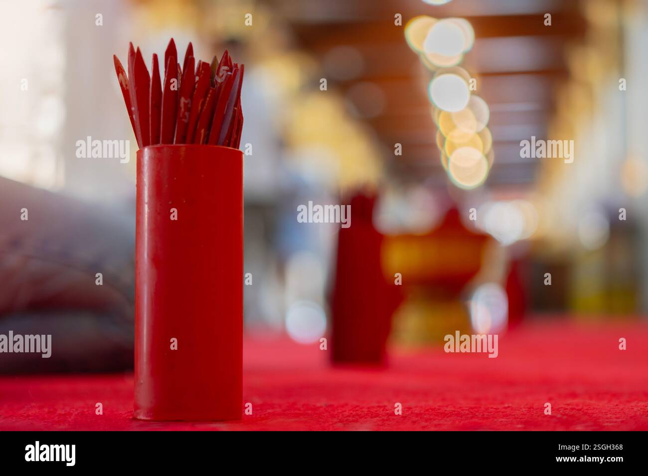 Chinese red bamboo fortune sticks with numbers, shake for future ...