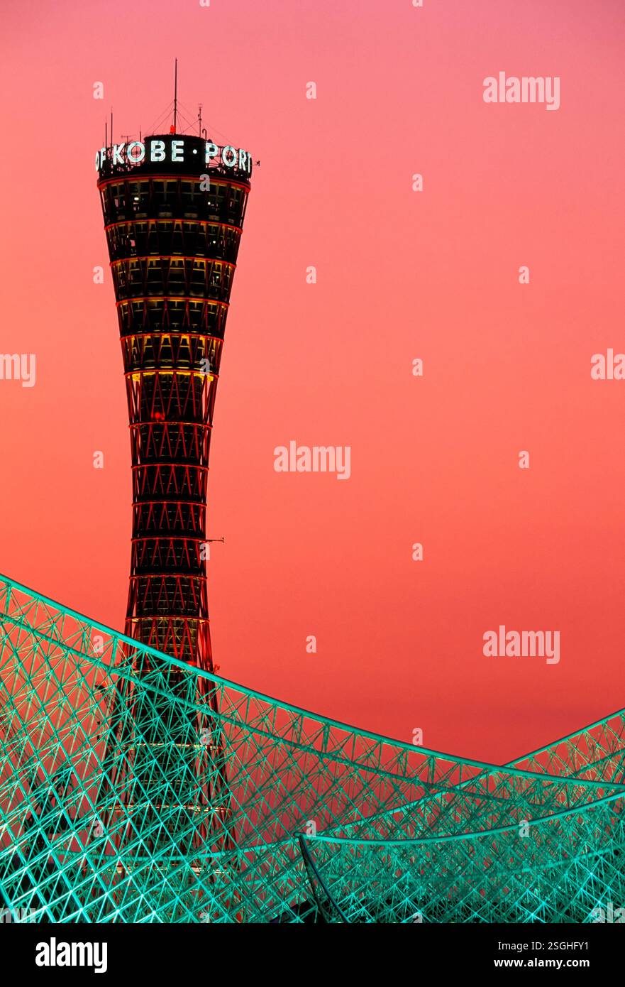 The Kobe Port Tower at sunset is a landmark in the port city of Kobe ...