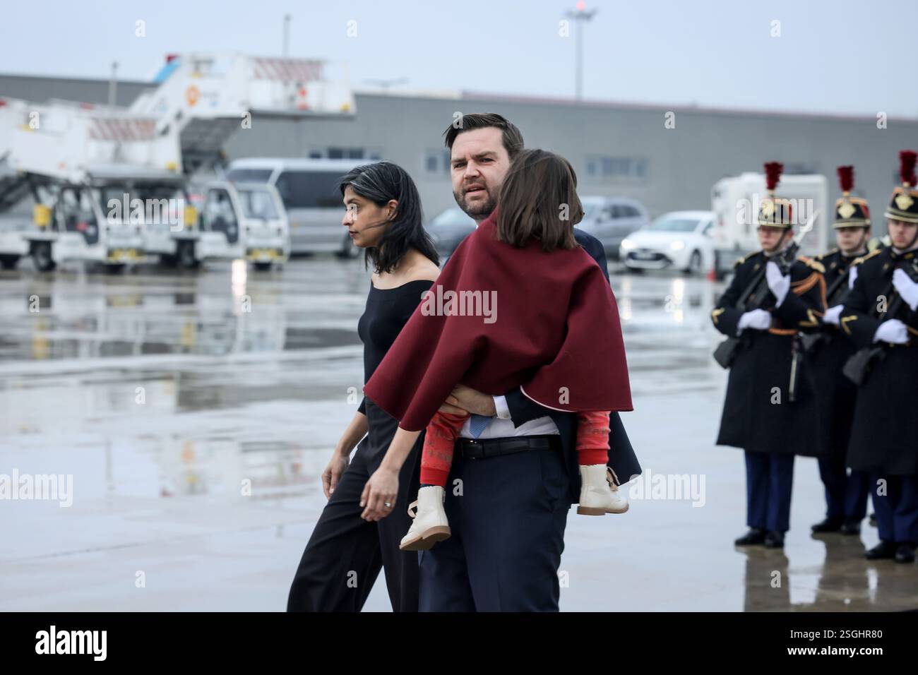 United States Vice-President JD Vance, center, carries his daughter ...