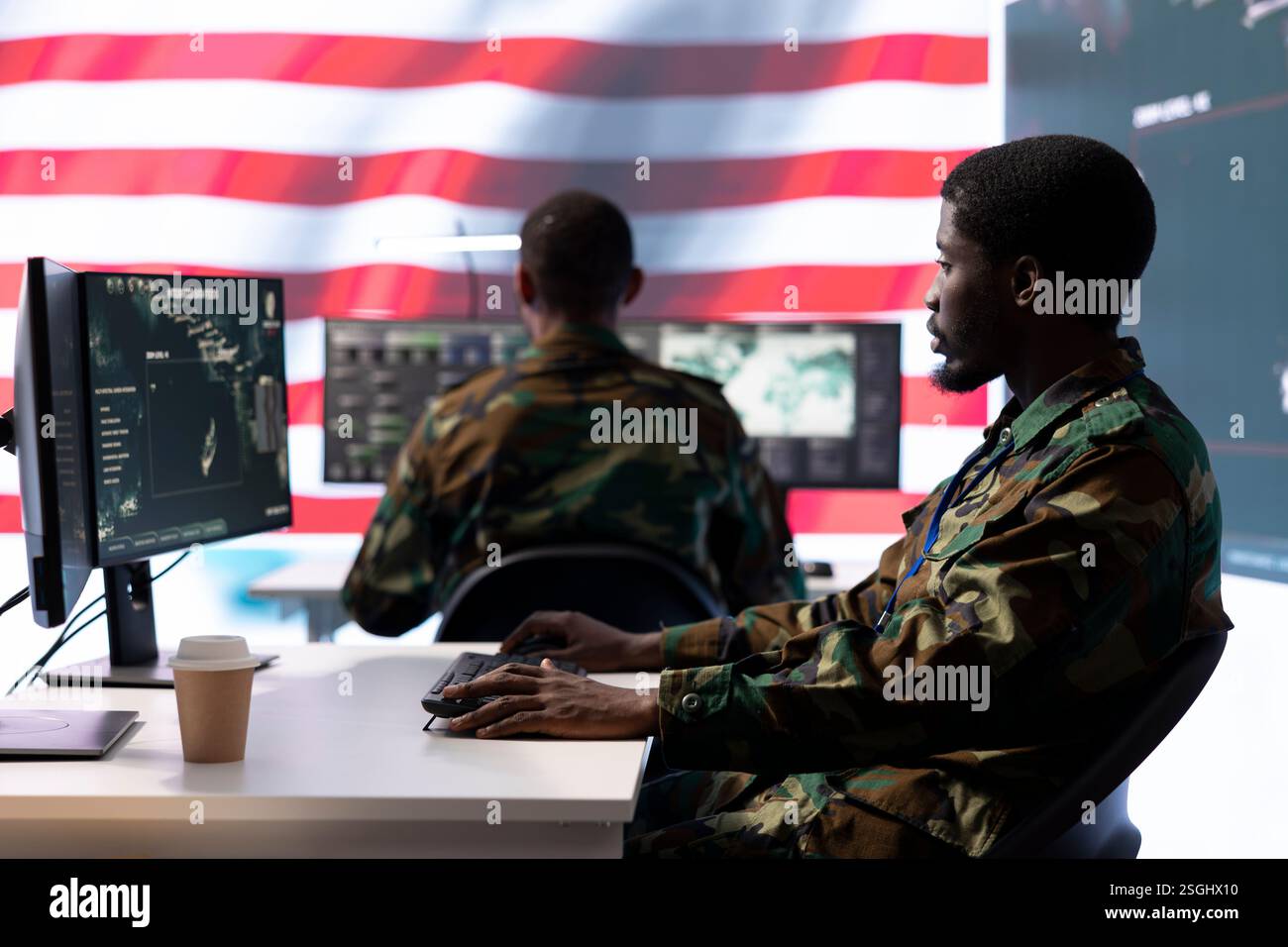 Intelligence officers in american military uniforms work on computers ...