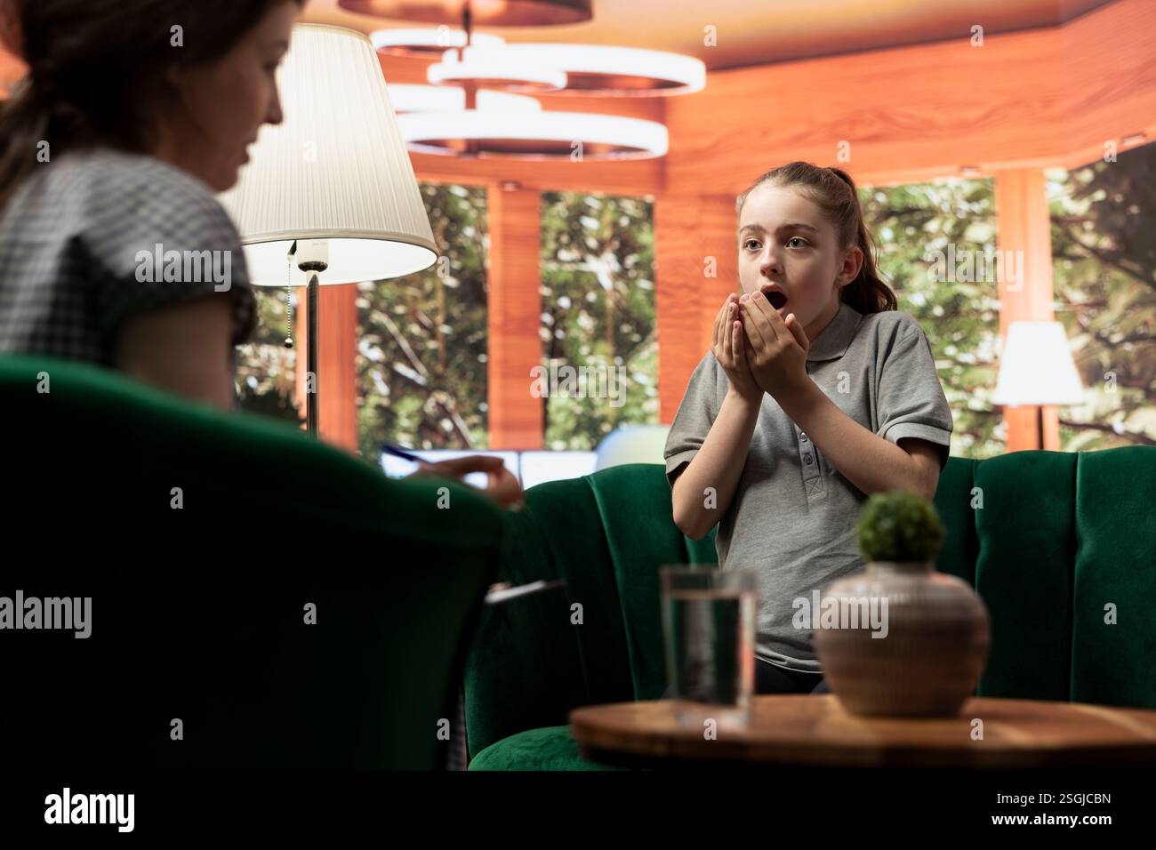 Therapist guides an angry teenager through a heated therapy session ...