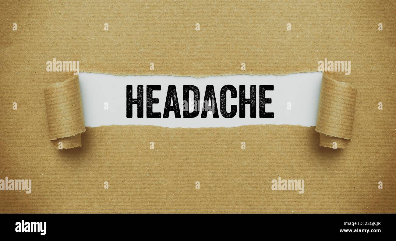 Torn paper revealing the word Headache Stock Photo - Alamy