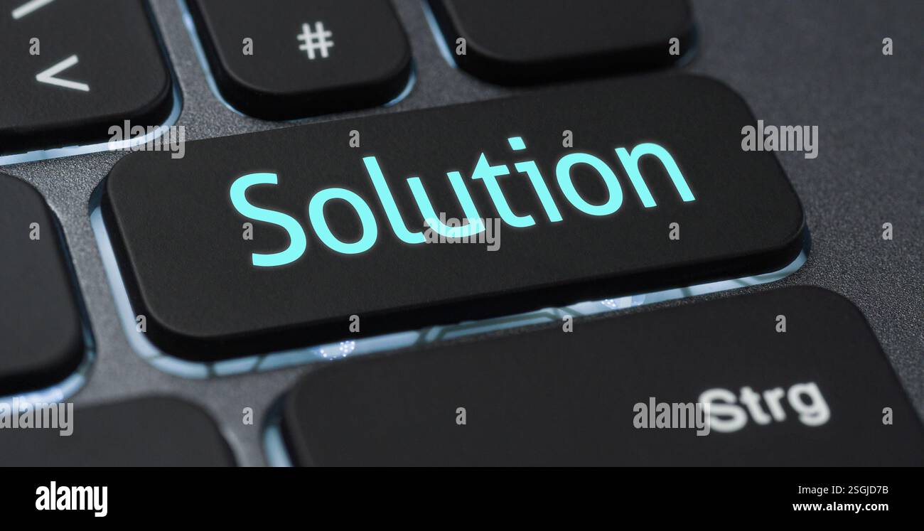 Illuminated keyboard with a labeled key - Solution Stock Photo - Alamy