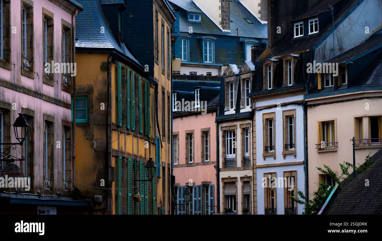 A street of colourful houses in the historic town of Quimper in ...