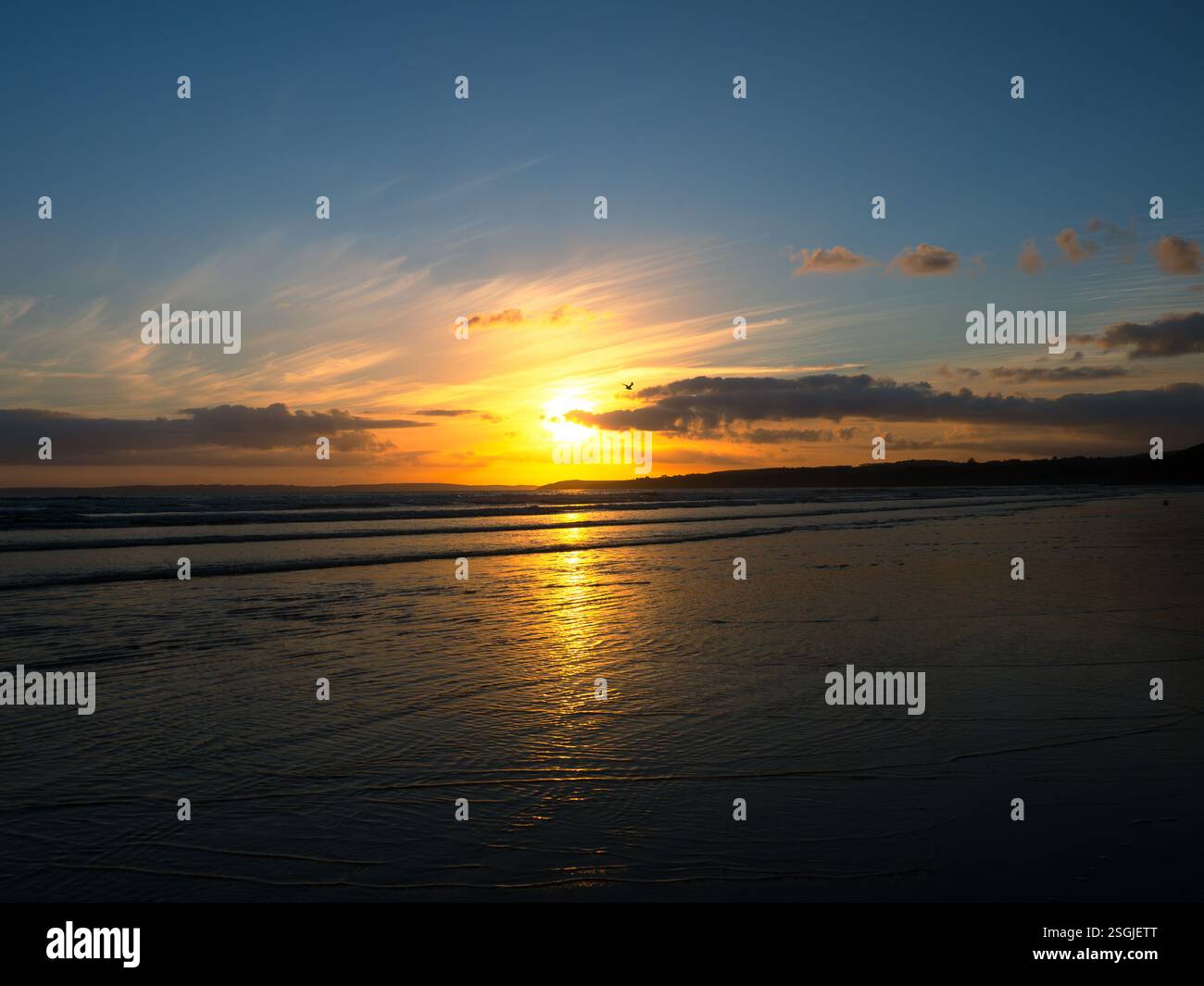 Vivid Golden Hour sunset over an empty bay in Brittany, Northern France ...