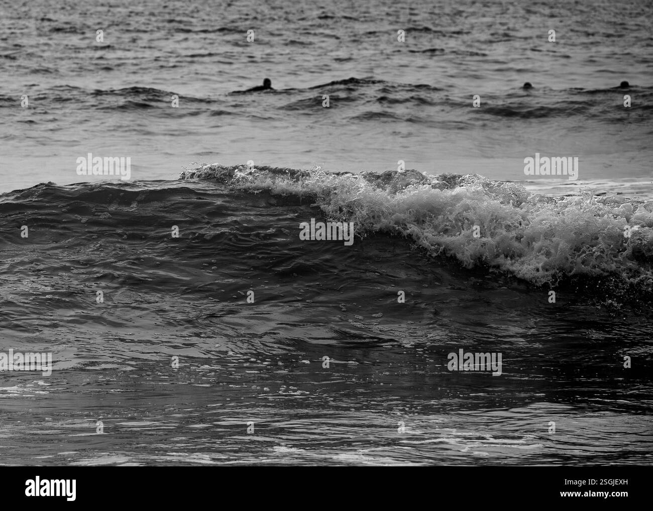 A breaking wave on an Atlantic Ocean beach in the Crozon Peninsula ...