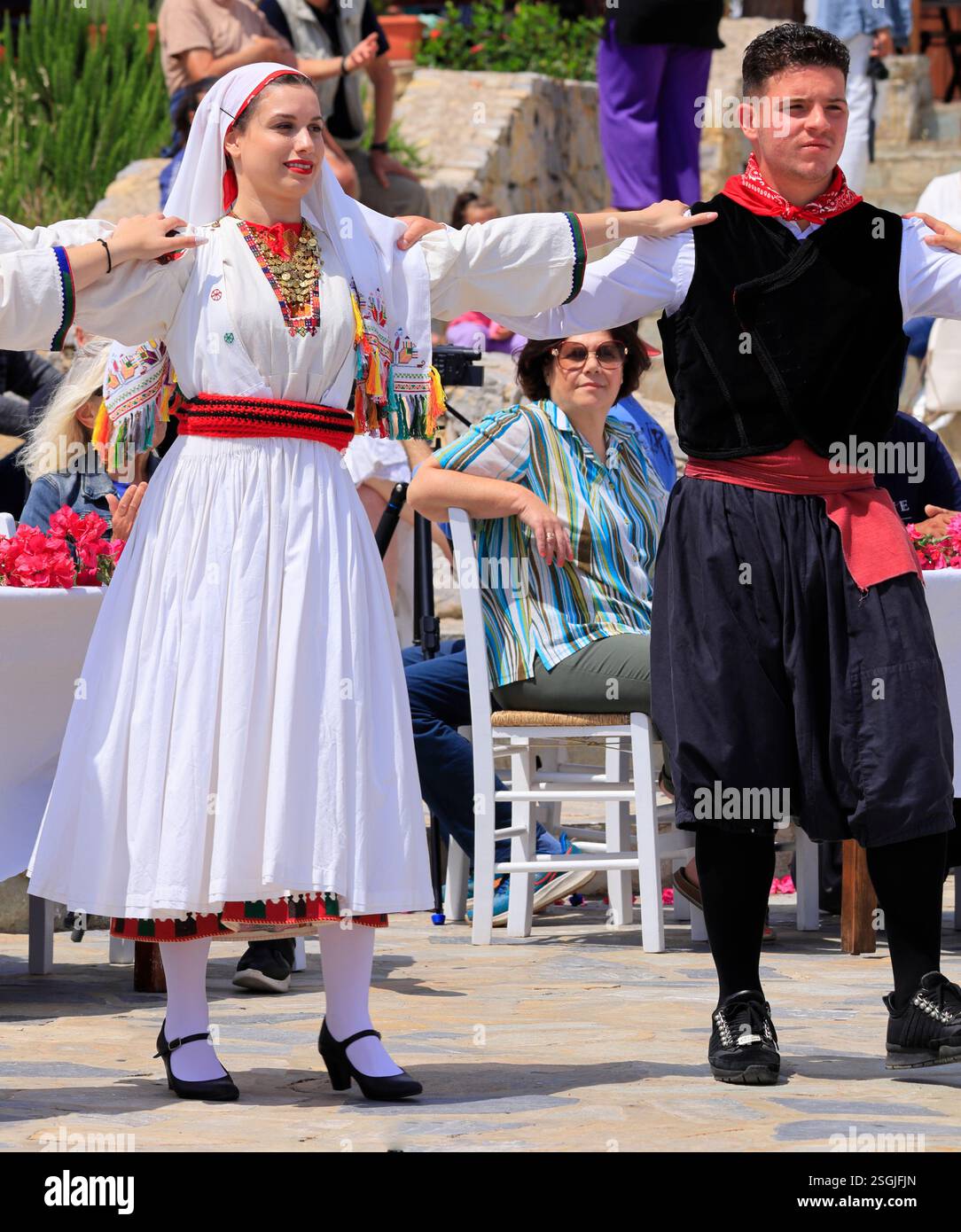 Traditional Greek dancers during the recording of a television ...
