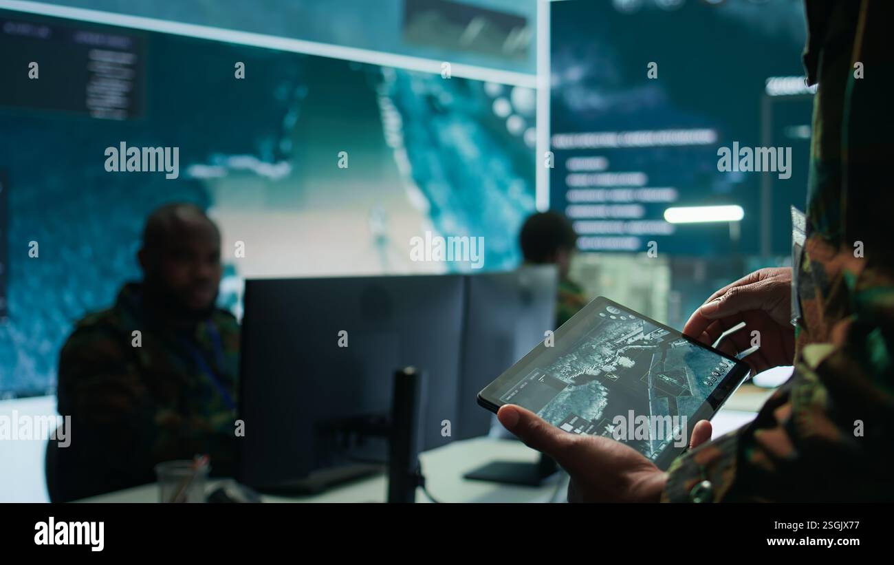 Military officer leads cybersecurity operations in a high tech ...