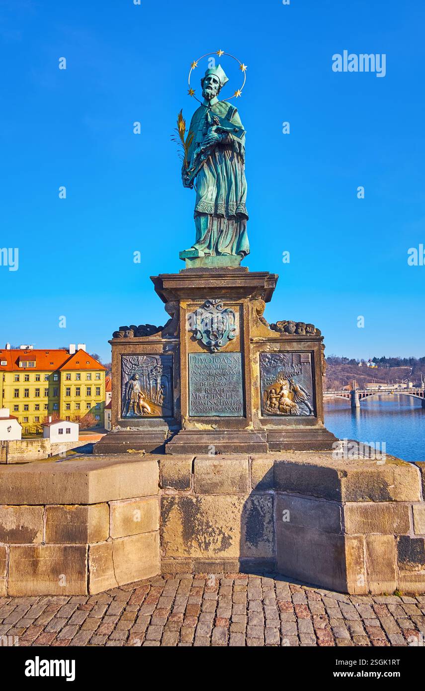The medieval bronze statue of St John of Nepomuk on the Charles Bridge ...