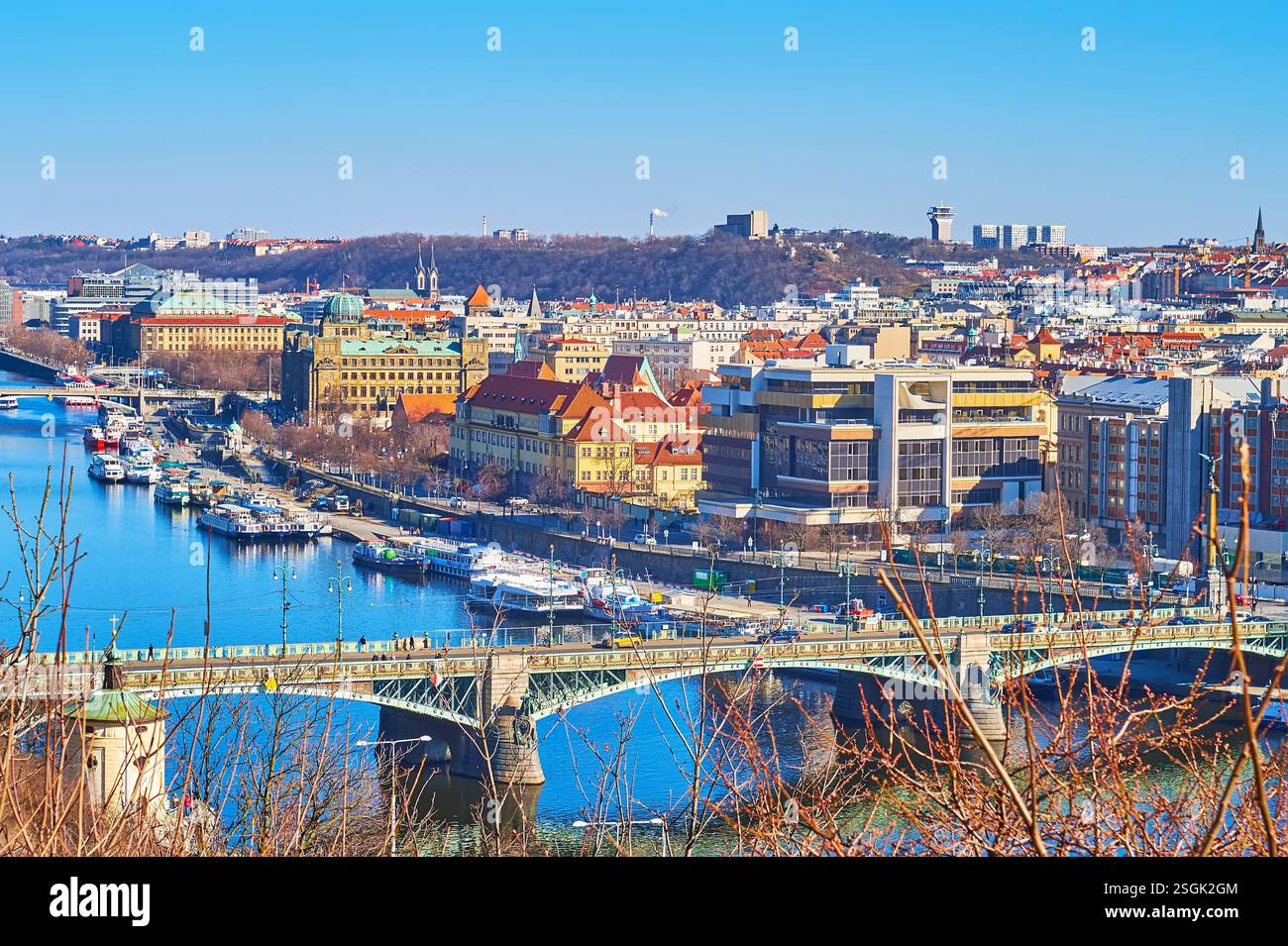 The scenic Cech Bridge across the Vltava River and housing along the ...