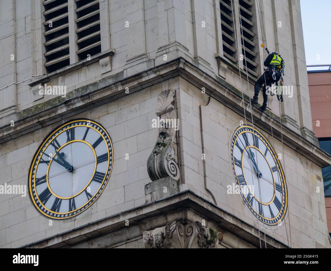 Abseiling rope access technicians at work on the clock tower of St ...