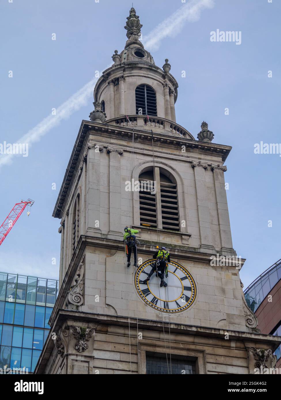 Abseiling rope access technicians at work on the clock tower of St ...