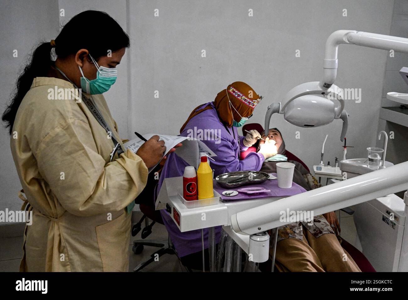 South Tangerang, Indonesia. 10th Feb, 2025. A medical worker offers an ...