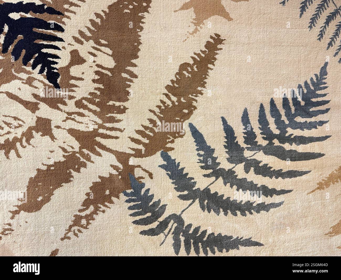 Close up of carpet rug with palm leaves pattern in shades of brown ...