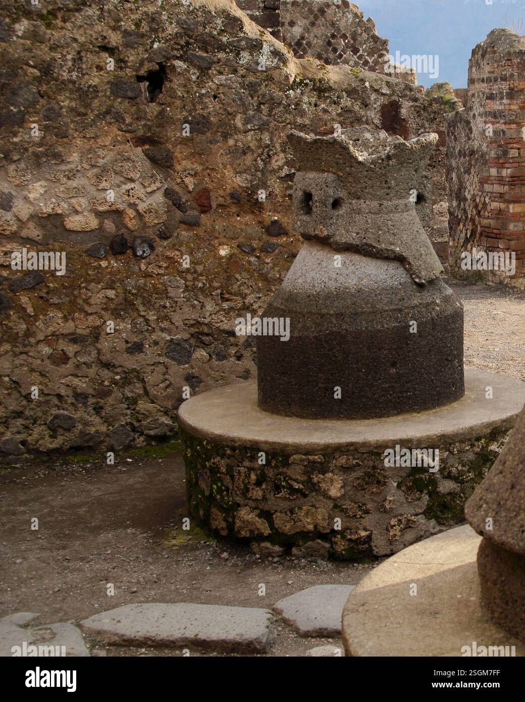 Millstone in the pistrinum, (bakery), Pompeii, Italy, 2009. The Roman ...