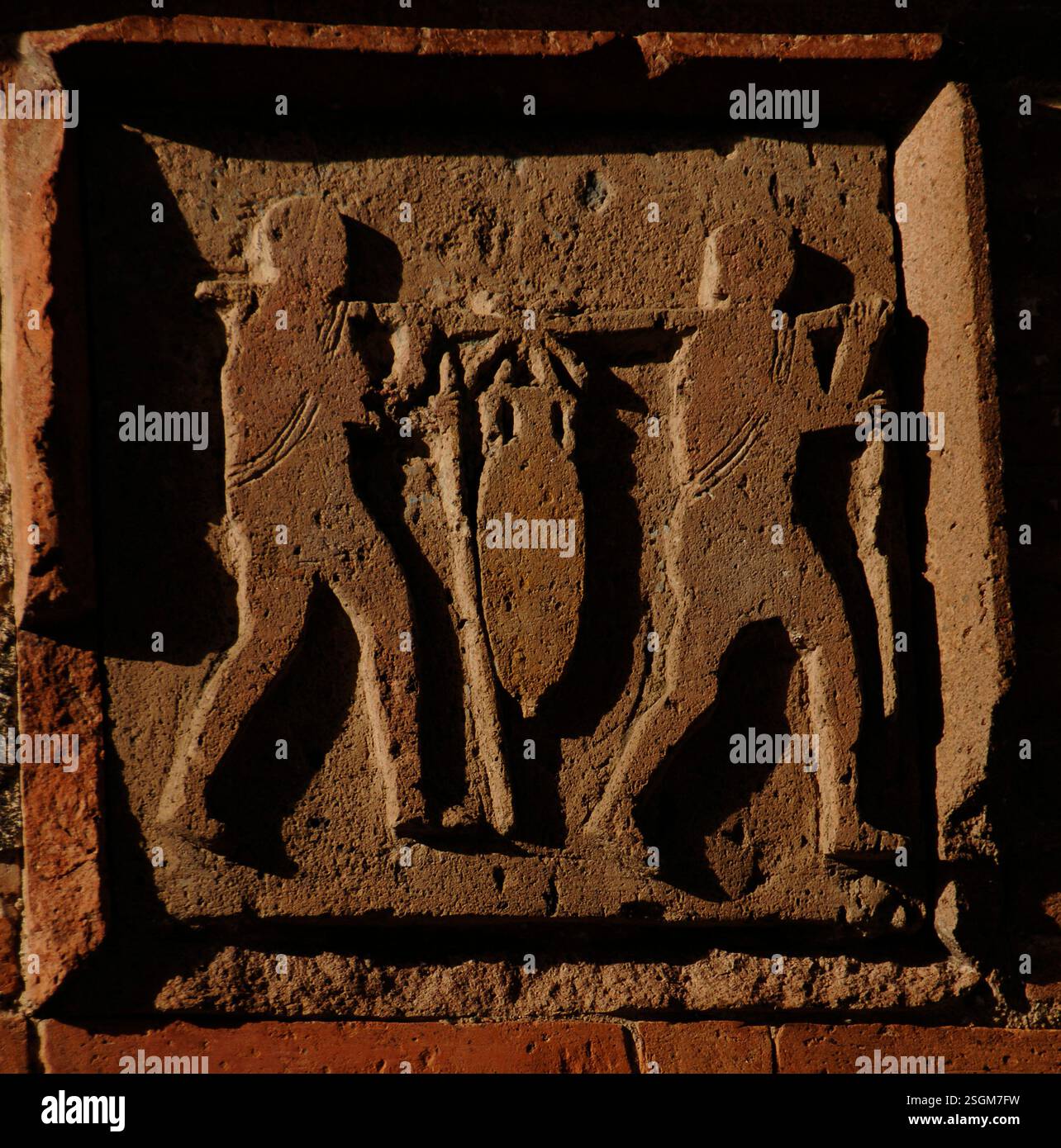 Relief depicting two men carrying an amphora, Pompeii, Italy, 2009. The ...