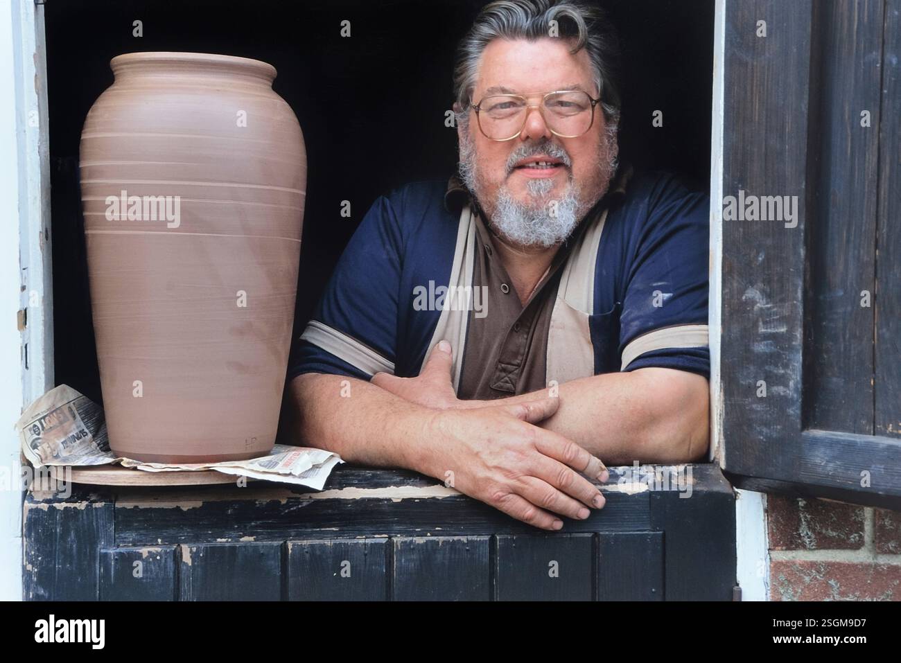 A traditional potter with a some of his vases. Brinkhill Pottery ...