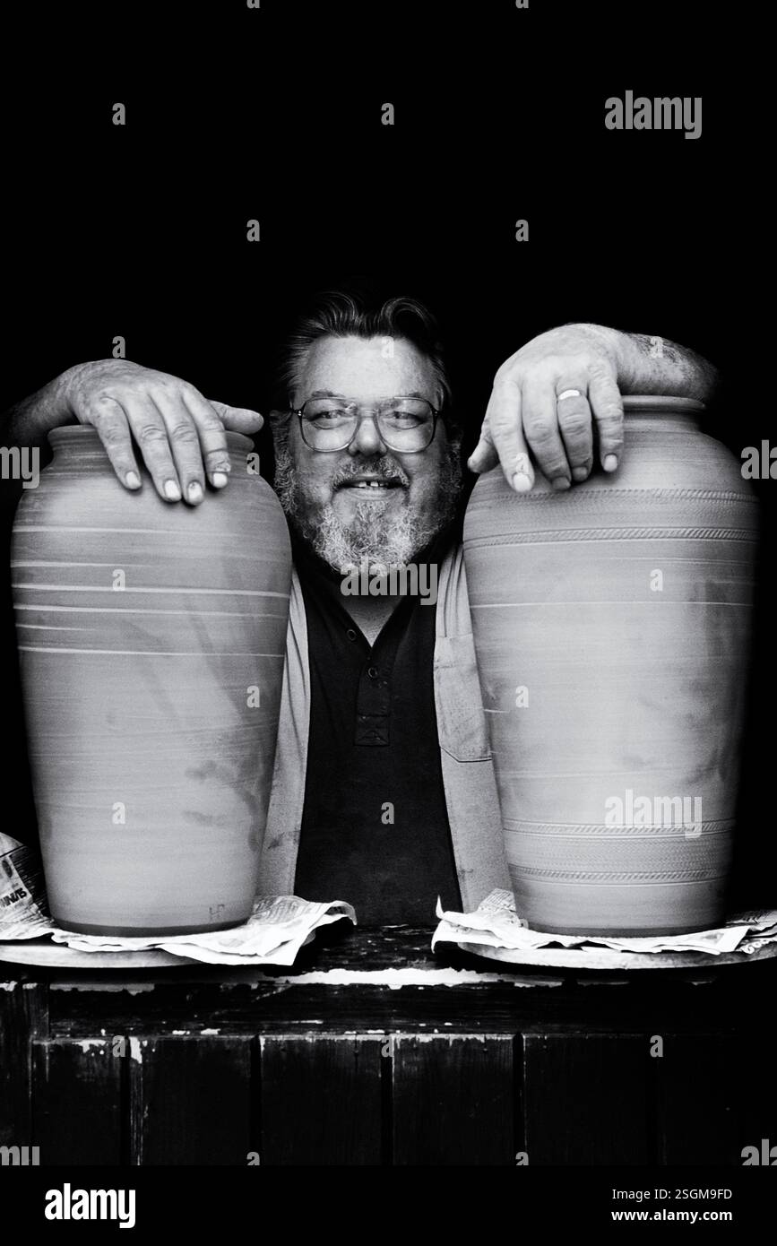A traditional potter with a some of his vases. Brinkhill Pottery ...
