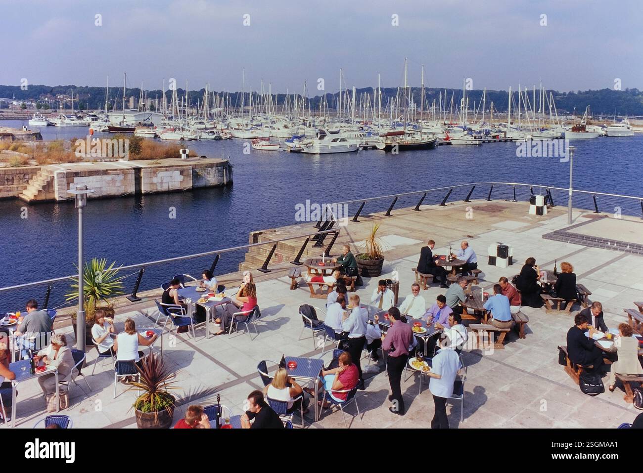 Outdoor diners at the Chatham maritime marina, Kent, England, UK. Circa ...