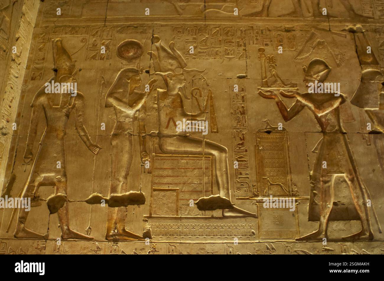 Relief of the Pharaoh Seti I offering a statue of goddess Maat to gods ...