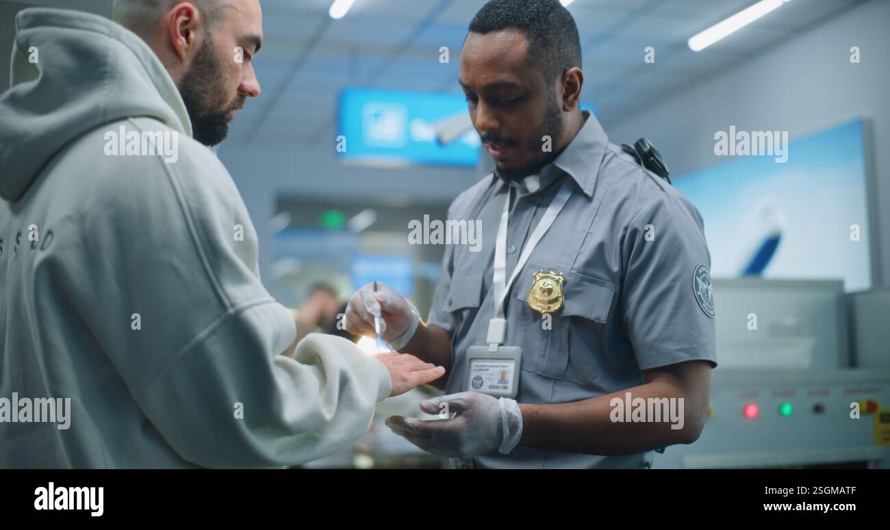Airport Terminal: African American Security Officer Conducts TSA Hand ...
