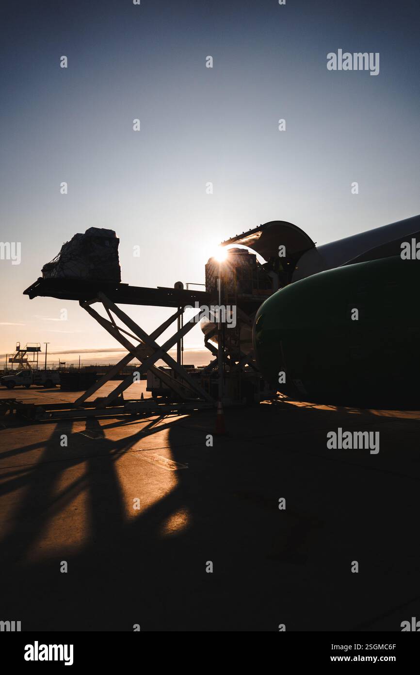 Heavy cargo airplane being load before flight Stock Photo - Alamy