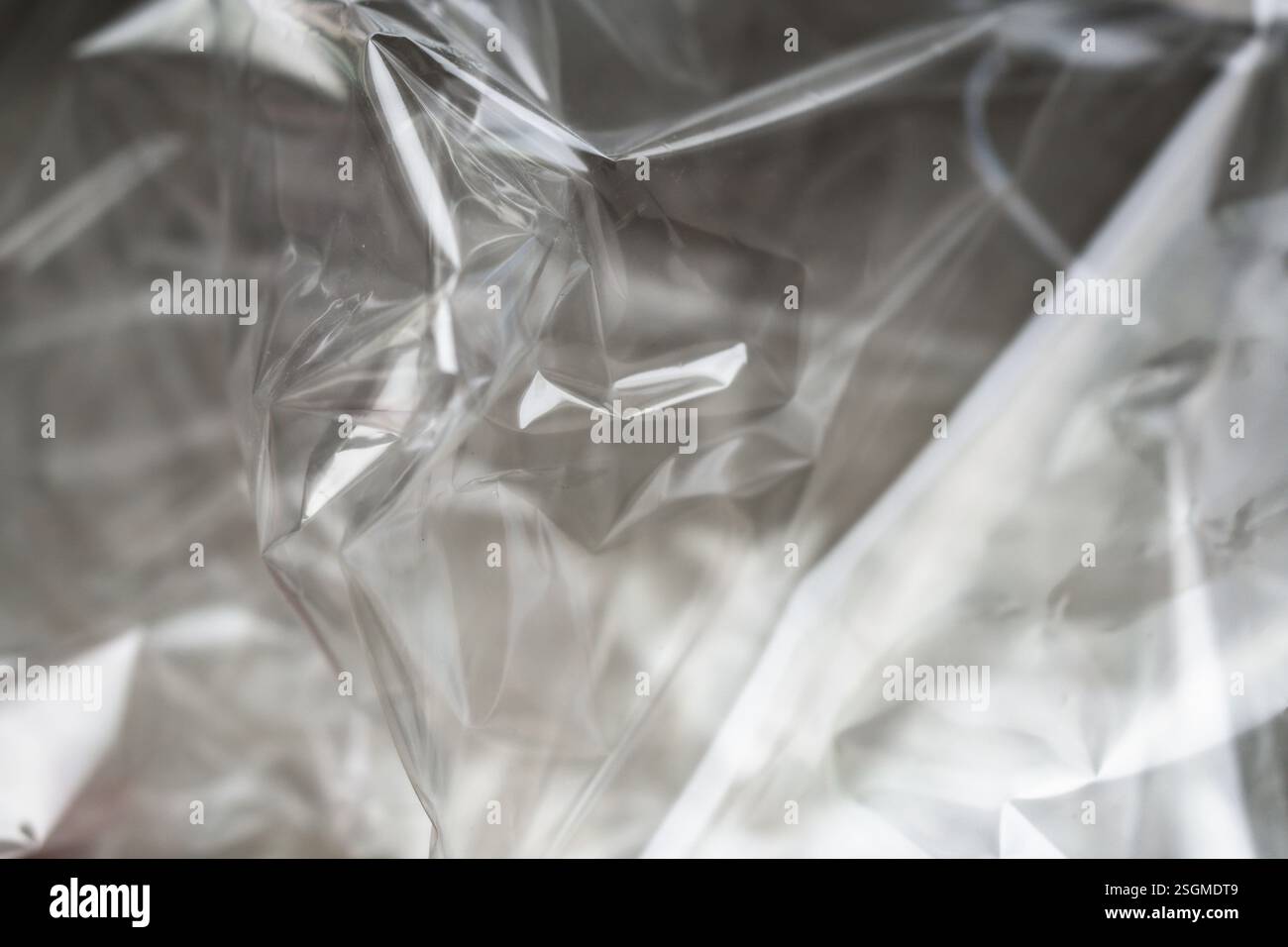Crumpled clear plastic background, abstract glossy broken surface ...