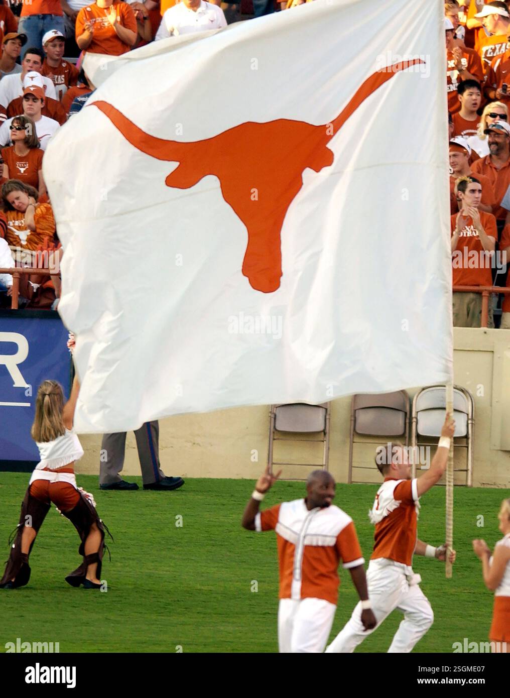 Cheerleaders carry the Texas Longhorns flag in Celegration Stock Photo ...