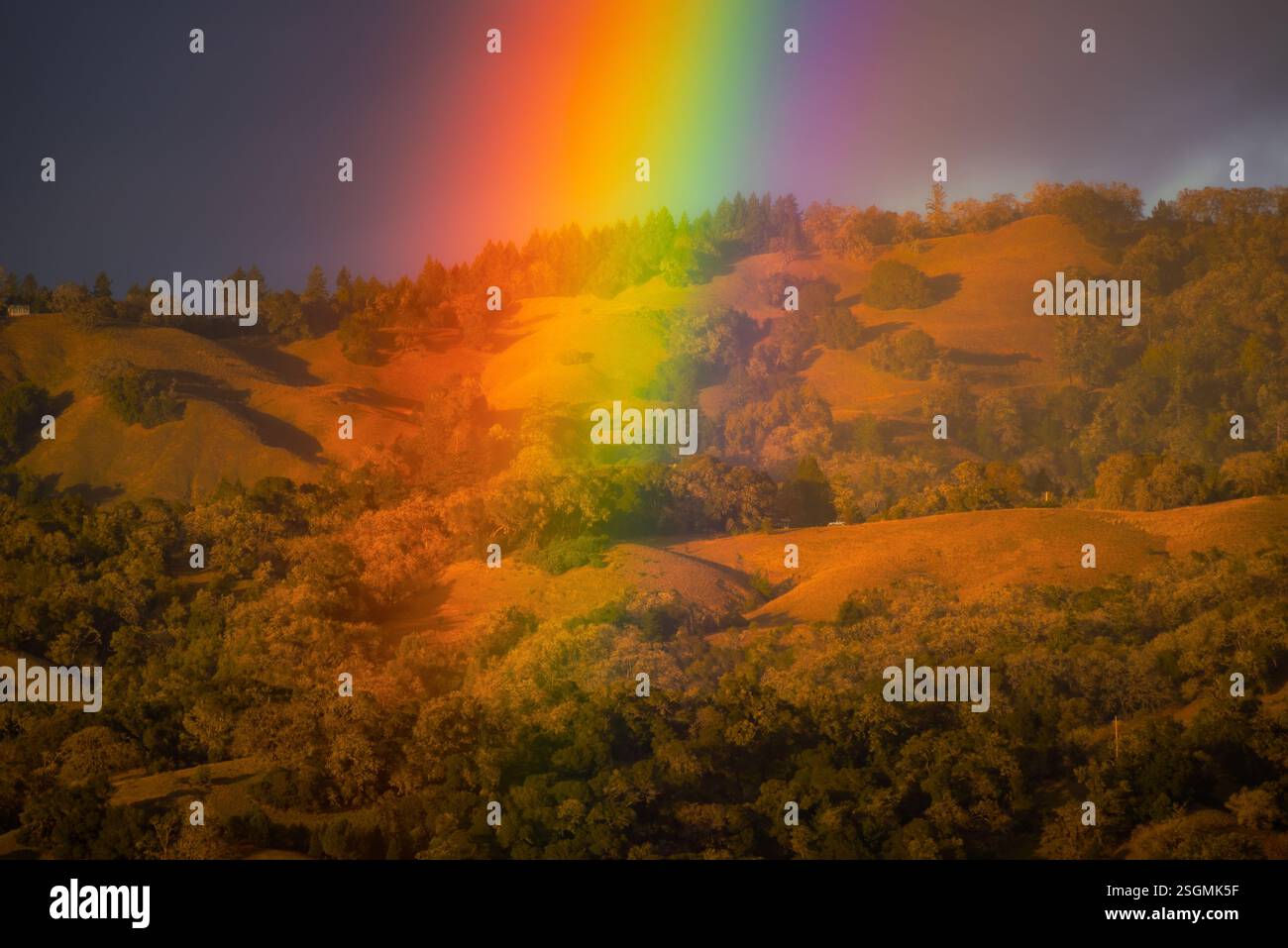 A breathtaking display of nature showcases rolling hills illuminated by ...