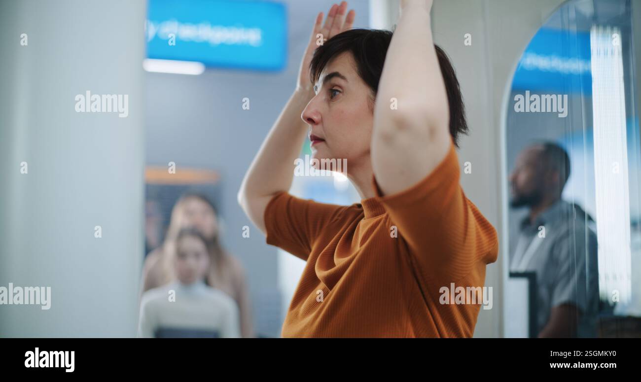 Security Checkpoint in Airport Terminal: Diverse People Passing Through ...